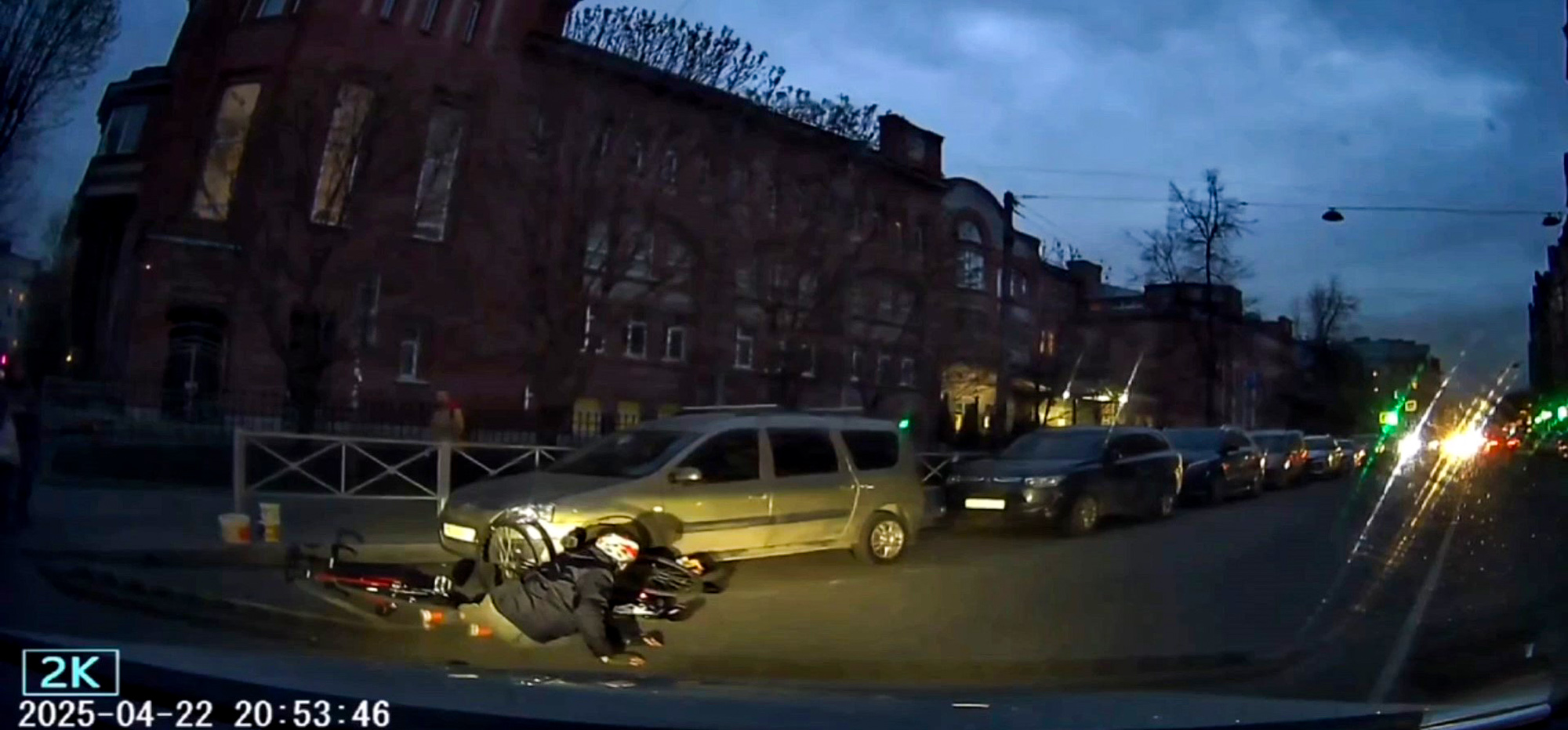 U IDIOT - Cyclists Crash In Tandem After Car Makes Sudden U-Turn